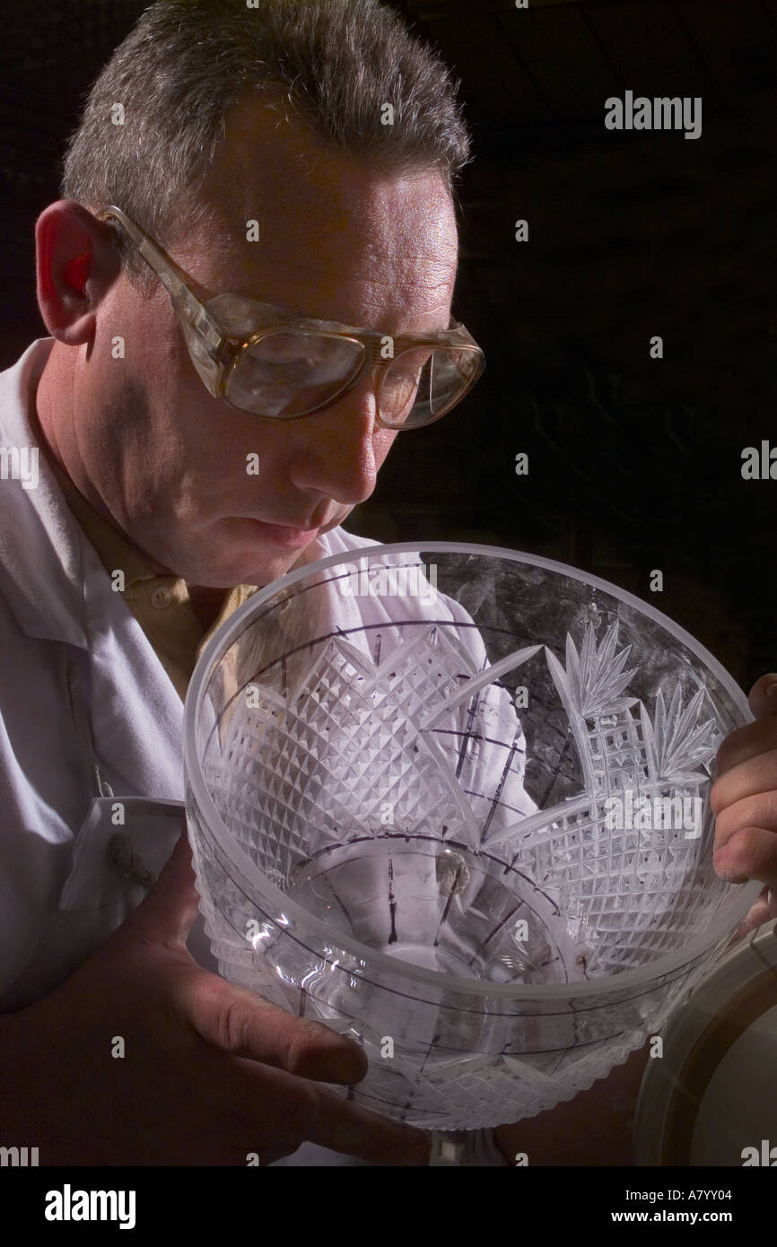 English glass craftsman polishing a cut glass crystal bowl UK Stock ...