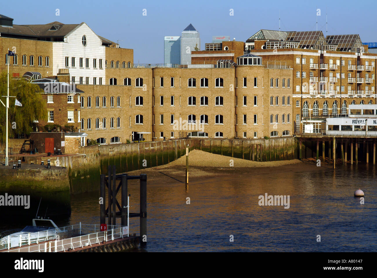 london river thames docklands old wharf buildings converted into ...