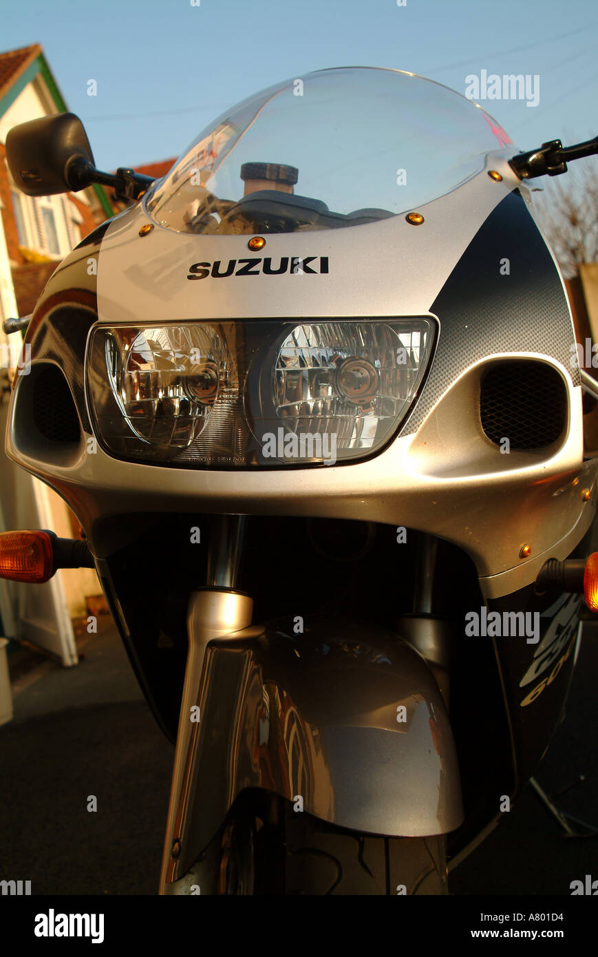 suzuki motorcycle parked outside detached house Stock Photo - Alamy