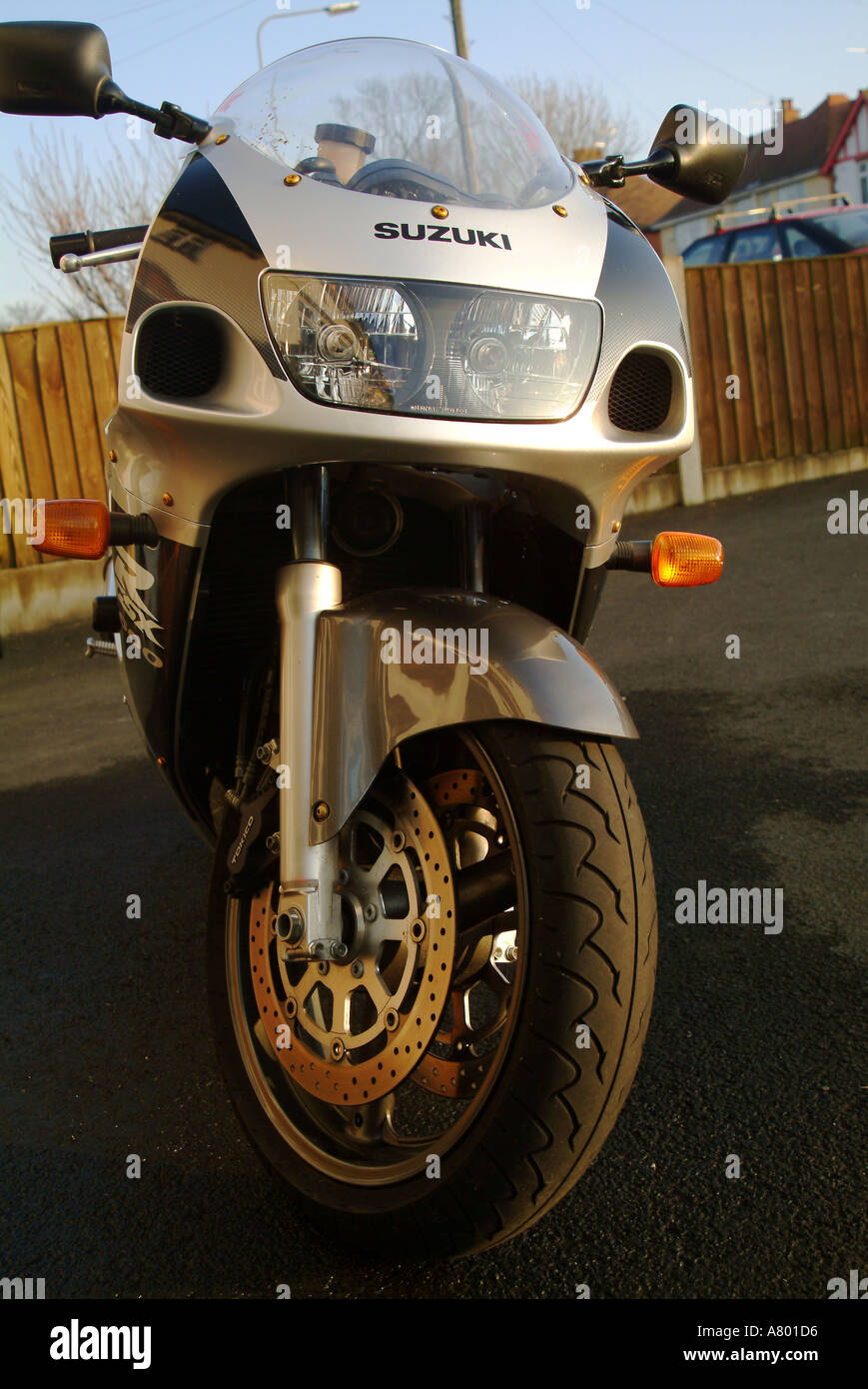 suzuki motorcycle parked outside detached house Stock Photo - Alamy
