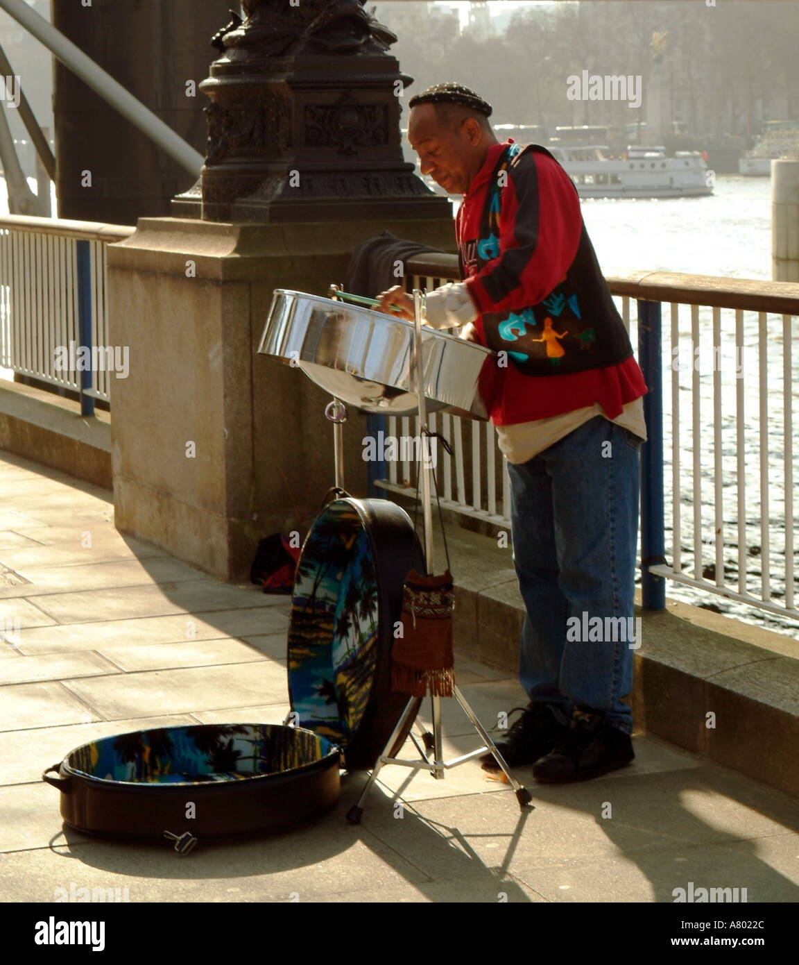 london river thames south bank steel pan player Stock Photo - Alamy