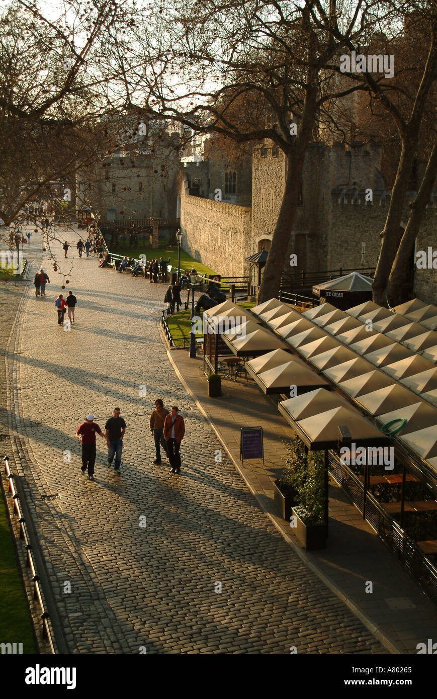 london the tower of london view of path alongside river thames view ...