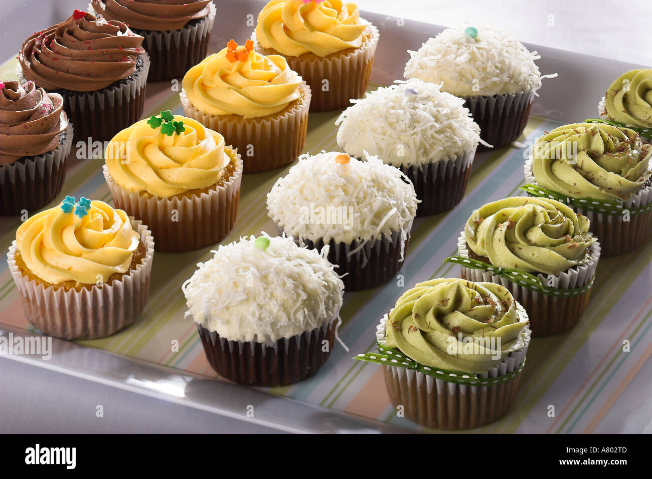 Varieties of cupcakes on a tray Stock Photo - Alamy