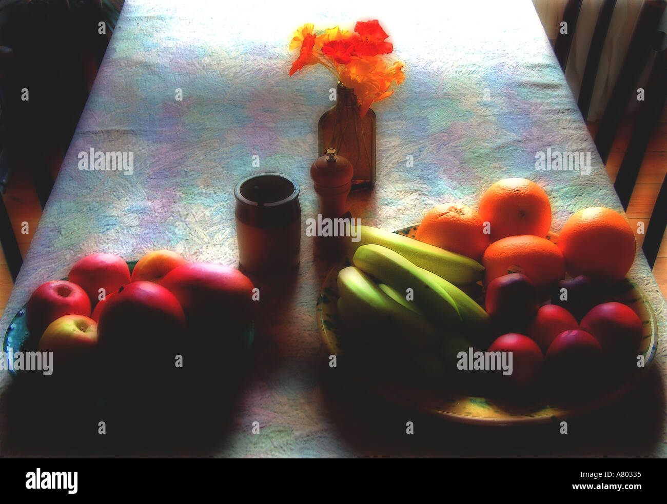 Still life of fruit and flowers on table Backlit Stock Photo - Alamy