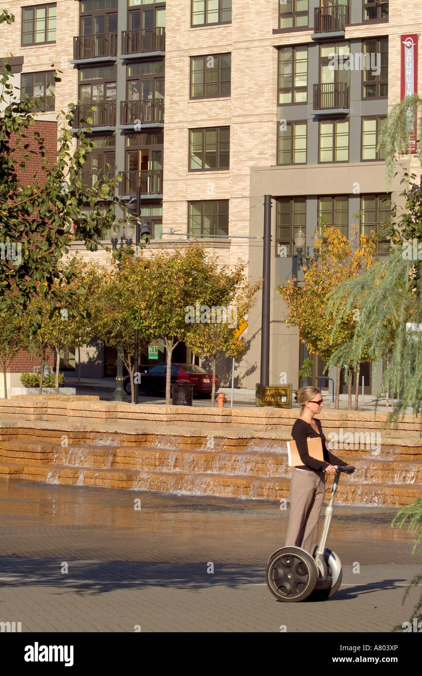A woman riding a Segway through a park in Portland's Pearl District ...
