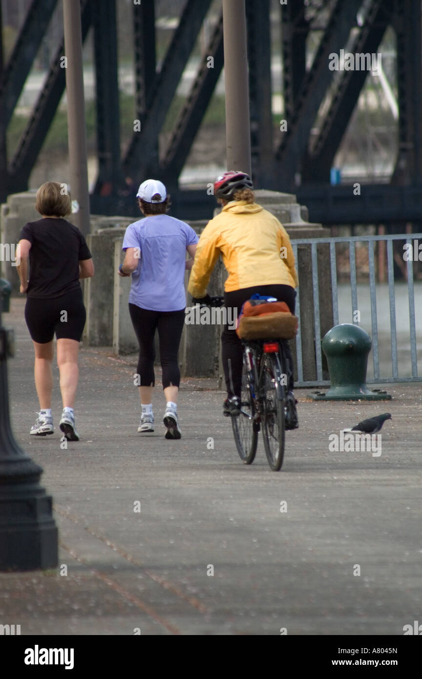 USA, Oregon, Portland, Biker & Runners at Waterfront Park Stock Photo ...