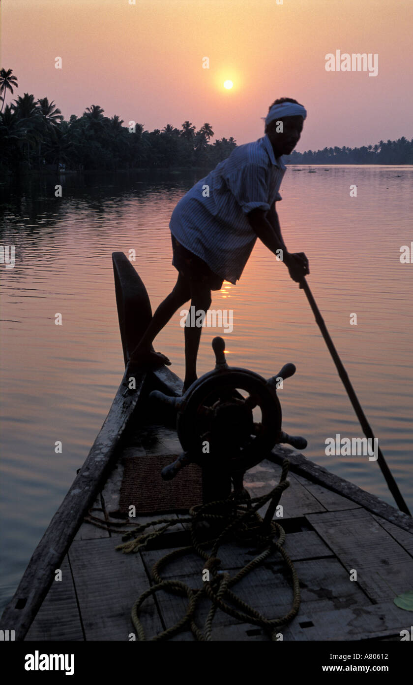 Boatman on the Backwaters at dusk Kerala India Stock Photo - Alamy