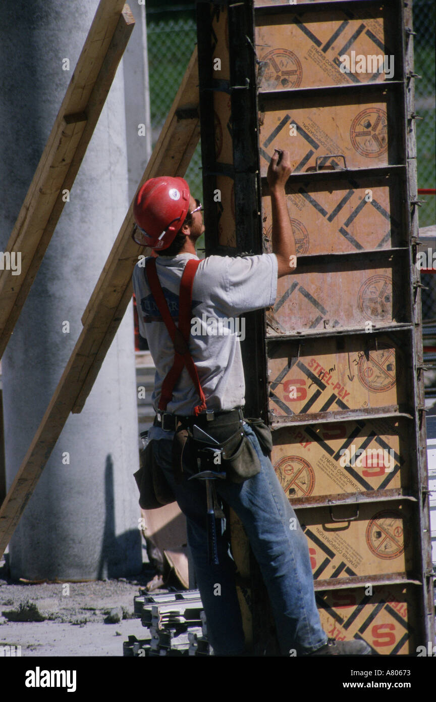 Construction worker installing insulation Stock Photo - Alamy
