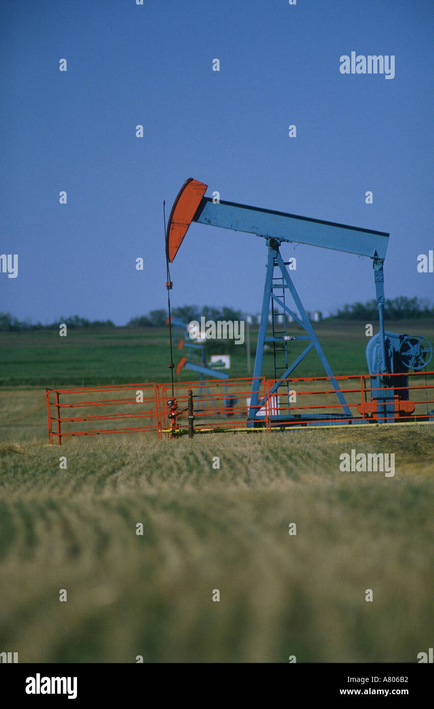 Pump jack with blue sky Stock Photo - Alamy