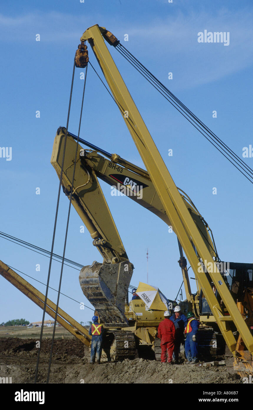 Pipe laying crane with a blue sky Stock Photo - Alamy