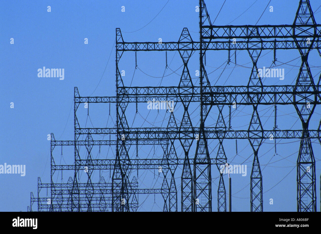 Electrical power lines with a blue sky Stock Photo - Alamy