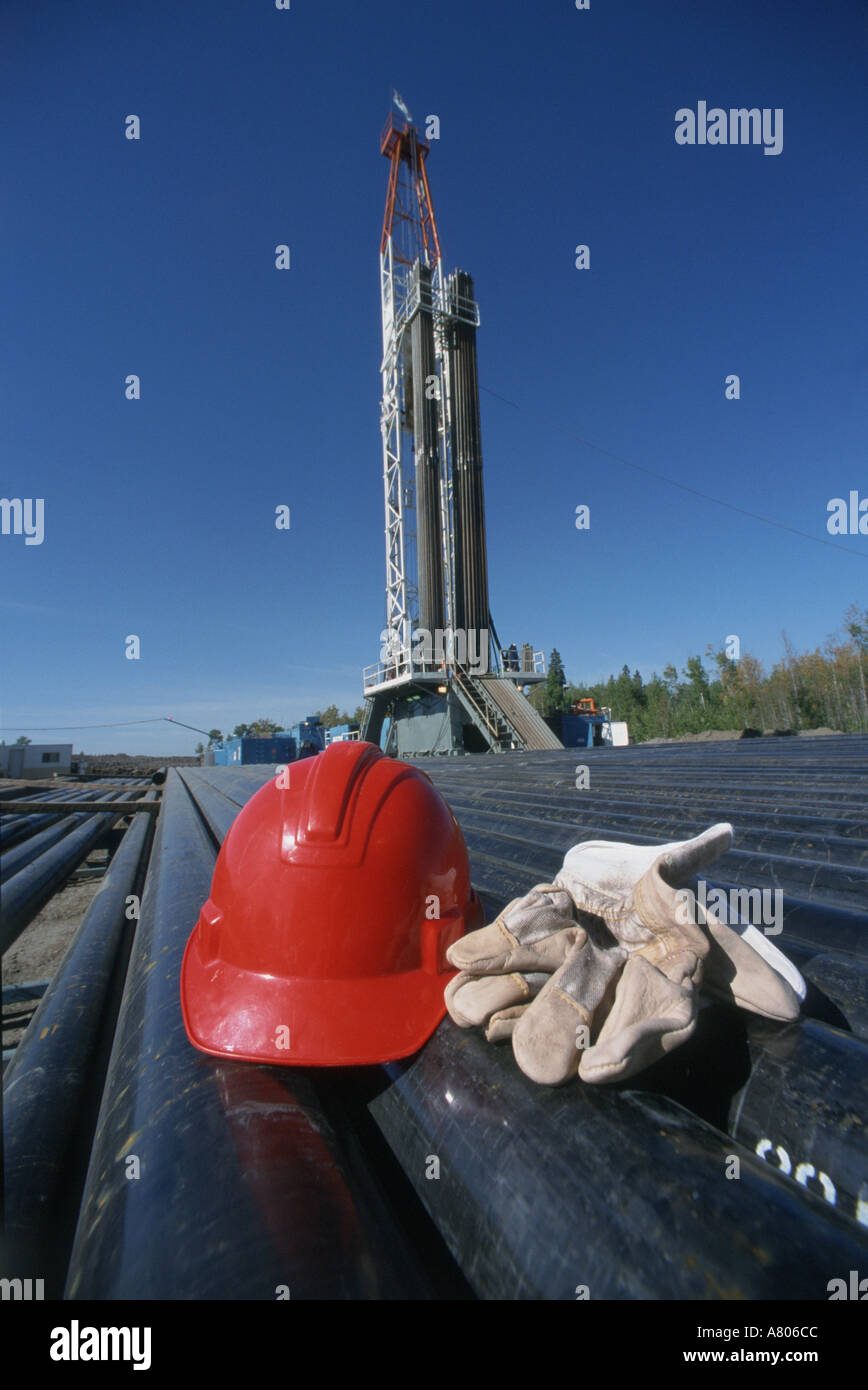 Derrick rig with hard hat and gloves Stock Photo - Alamy