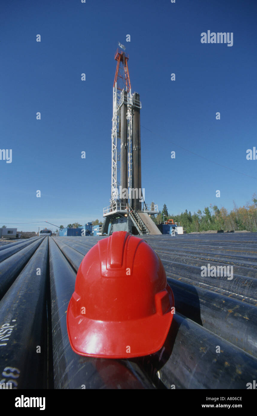 Derrick rig with hard hat and gloves Stock Photo - Alamy