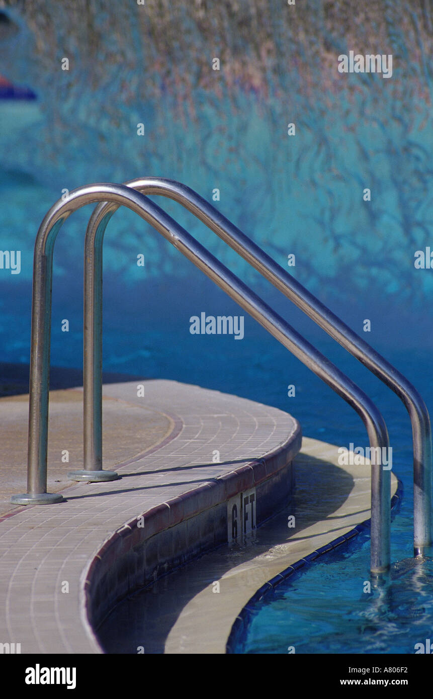 Resort pool with ladder Stock Photo - Alamy
