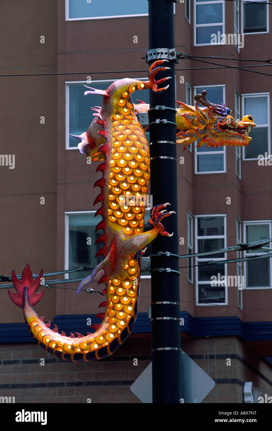 USA, Washington, Seattle. Dragon sculptures on light poles mark ...