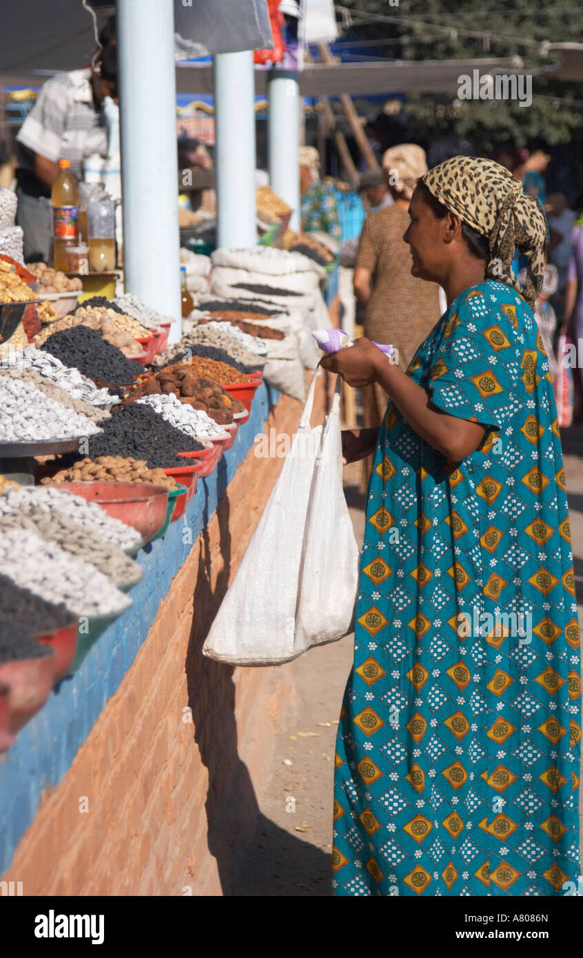 Woman Buying Nuts From Market Stall Stock Photo - Alamy