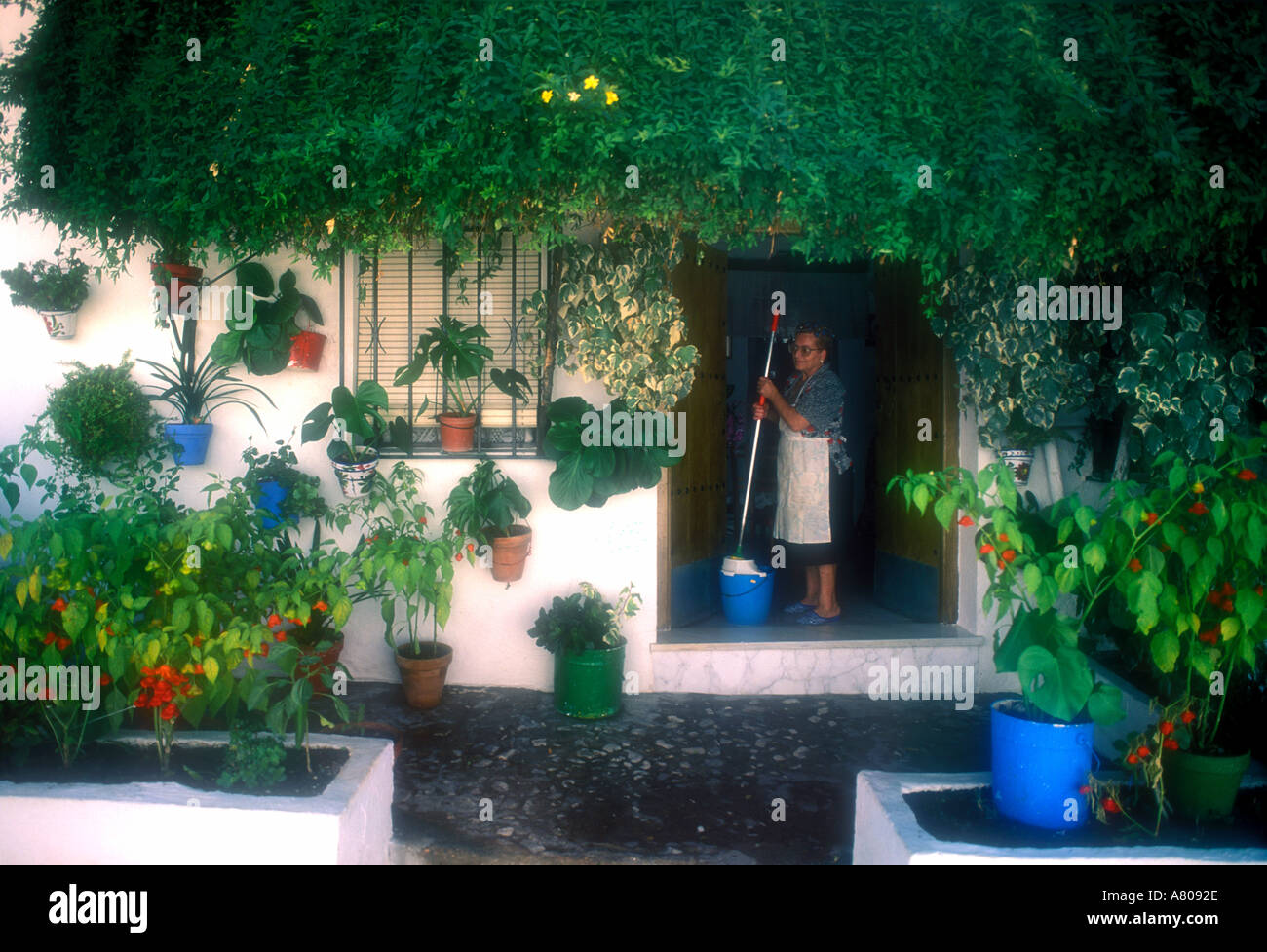 Lady outside house hi-res stock photography and images - Alamy