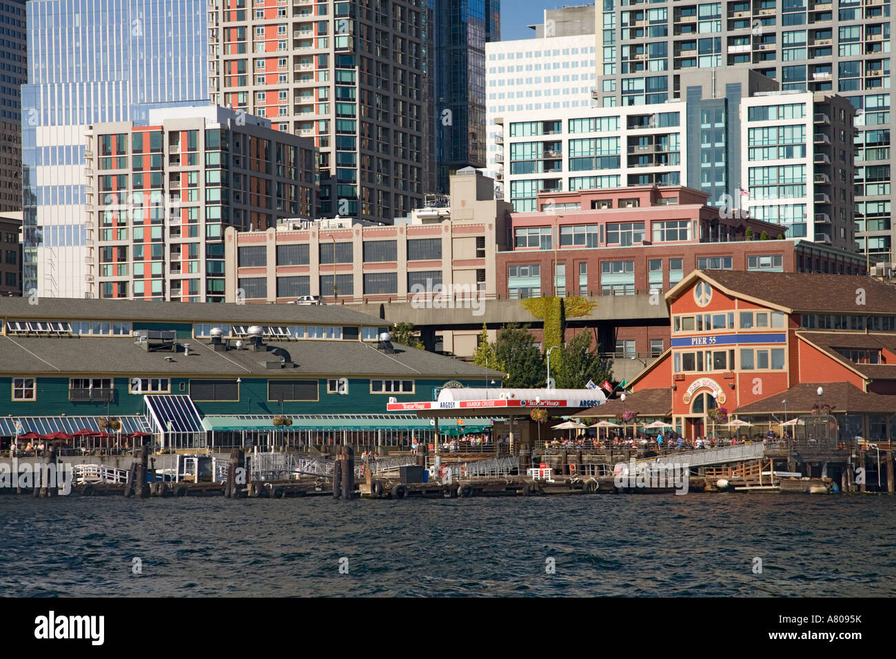 WA, Seattle, Piers 55 and 56 on Elliott Bay with Seattle skyline Stock ...