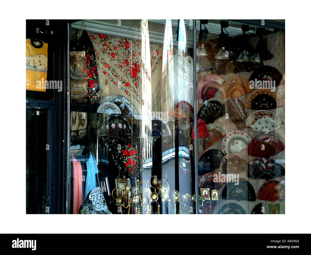 View through window of shop selling traditional Spanish fans in ...