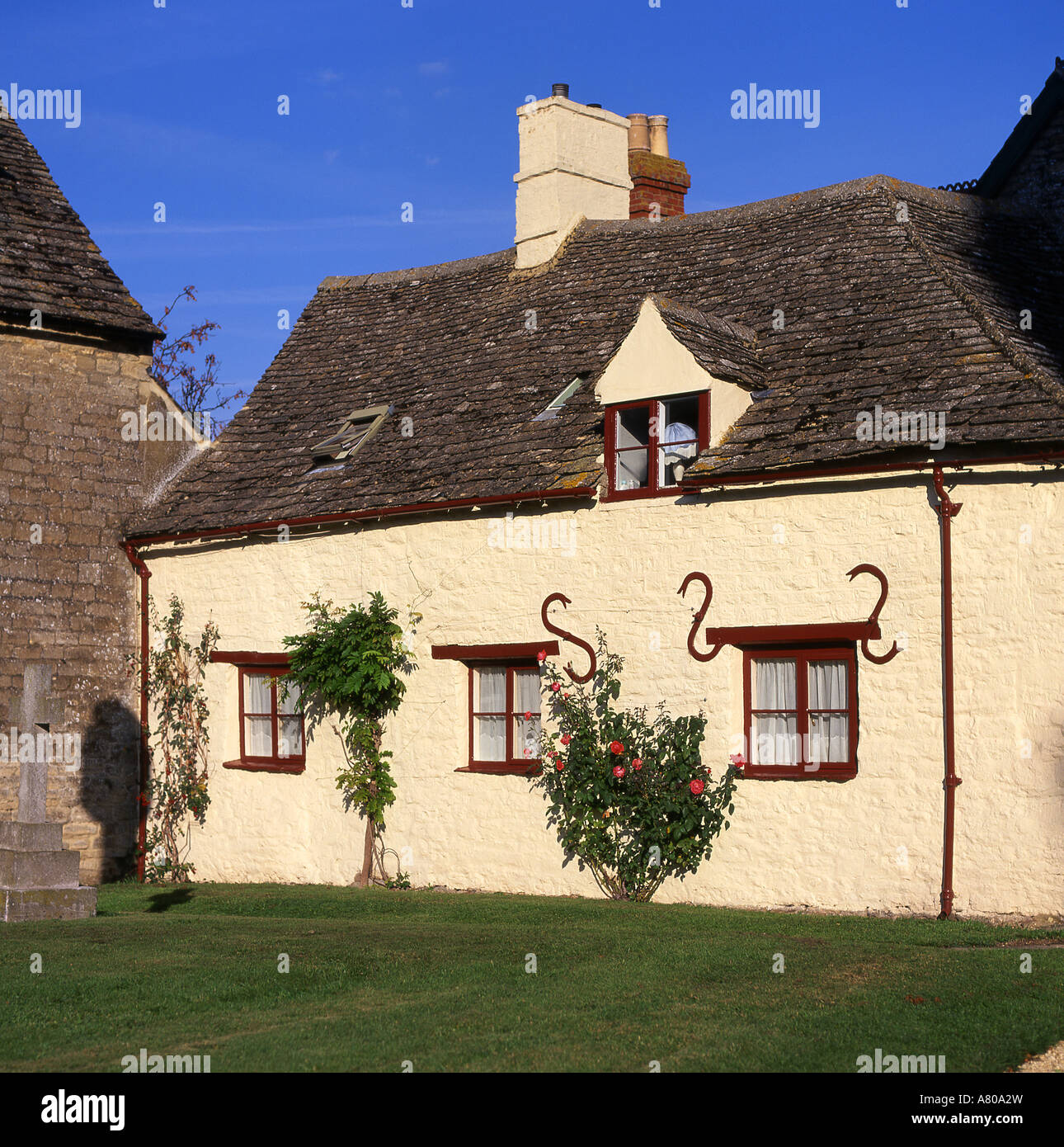 Old stone Cottage by churchyard at Cricklade in Wiltshire England Stock ...