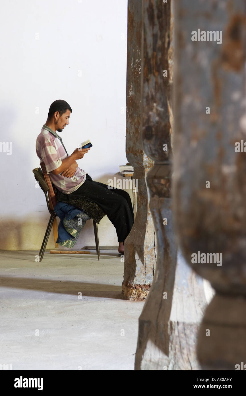 Uzbek Man Reading Book In Mosque Stock Photo - Alamy