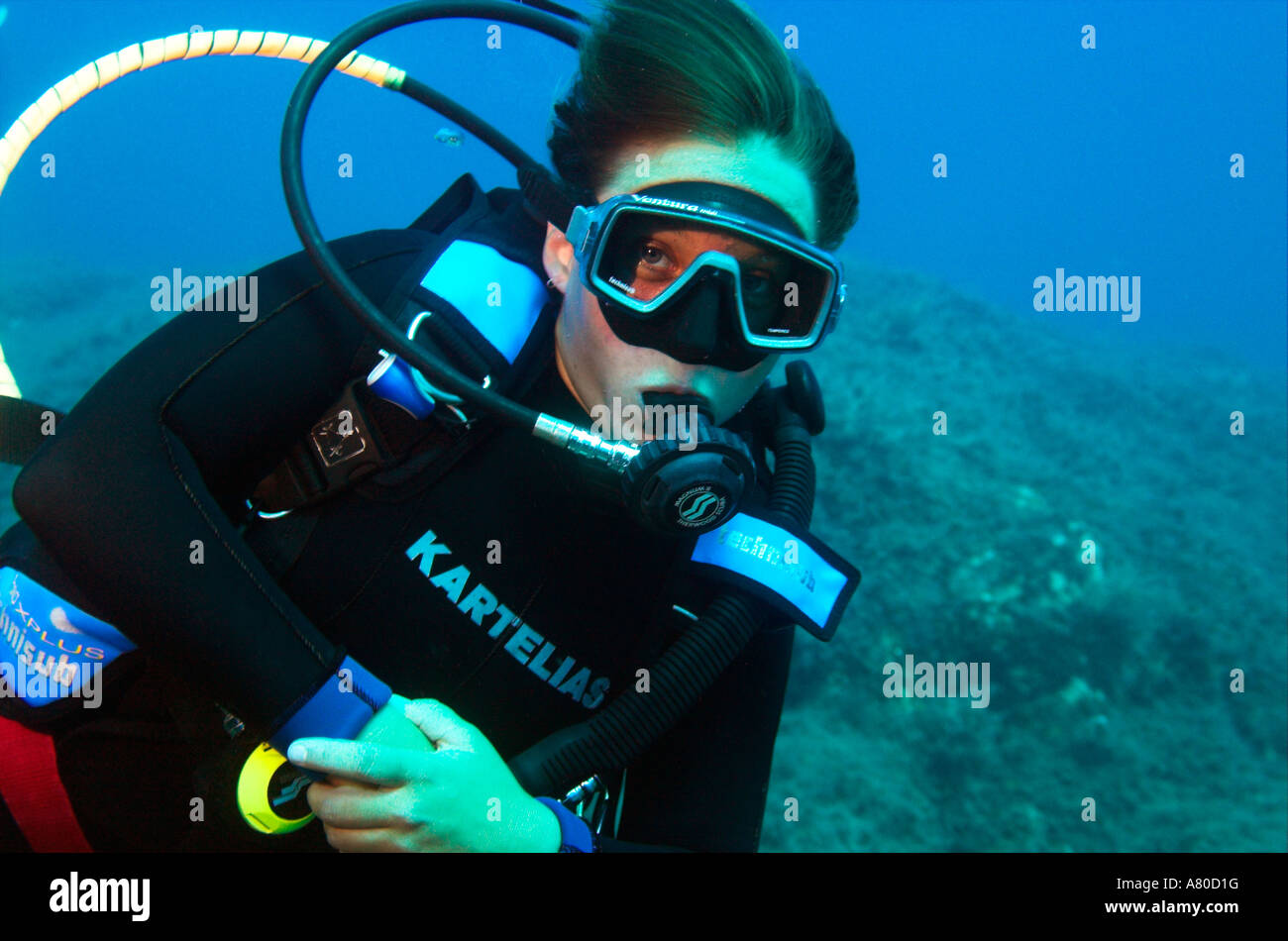 Portrait of woman scuba diver underwater in clear blue sea Stock Photo ...