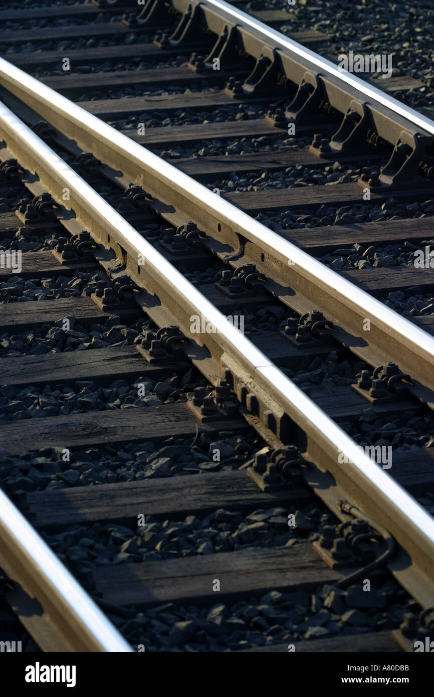 Rail tracks converging from two into one Stock Photo - Alamy