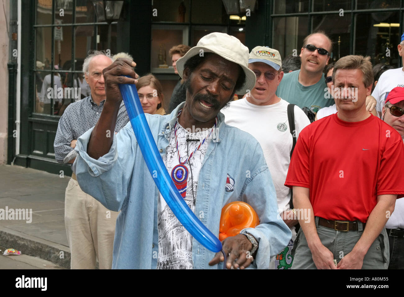 A street magician creating a balloon animal in the French Quarter New ...