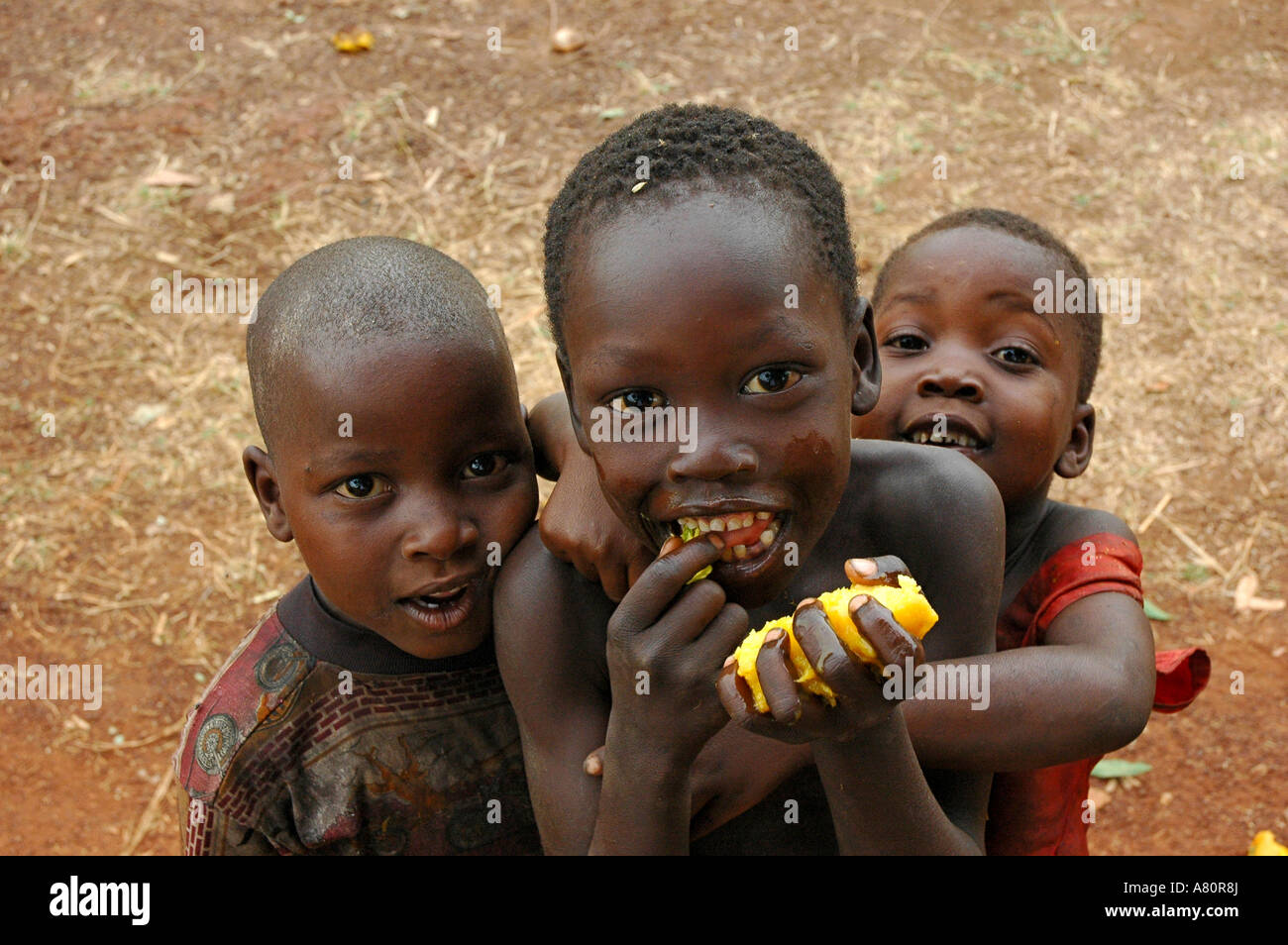 Children smile smiling mango hi-res stock photography and images - Alamy