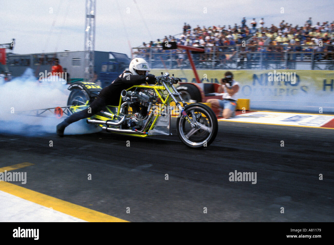 harley davidson drag racing motocycle burning rubber before a race at ...