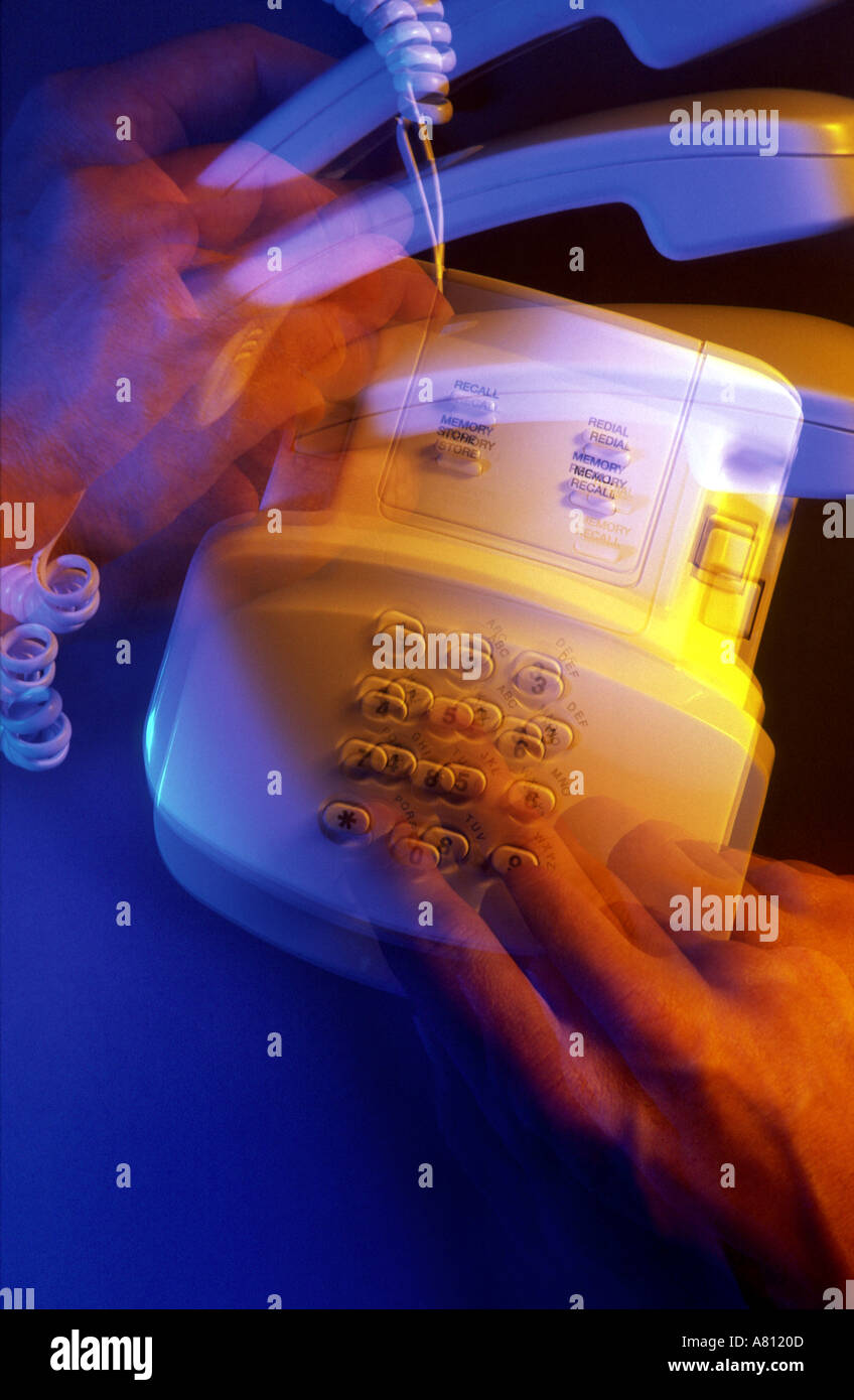 Hands picking up handset and speed dialing telephone,activity,active ...