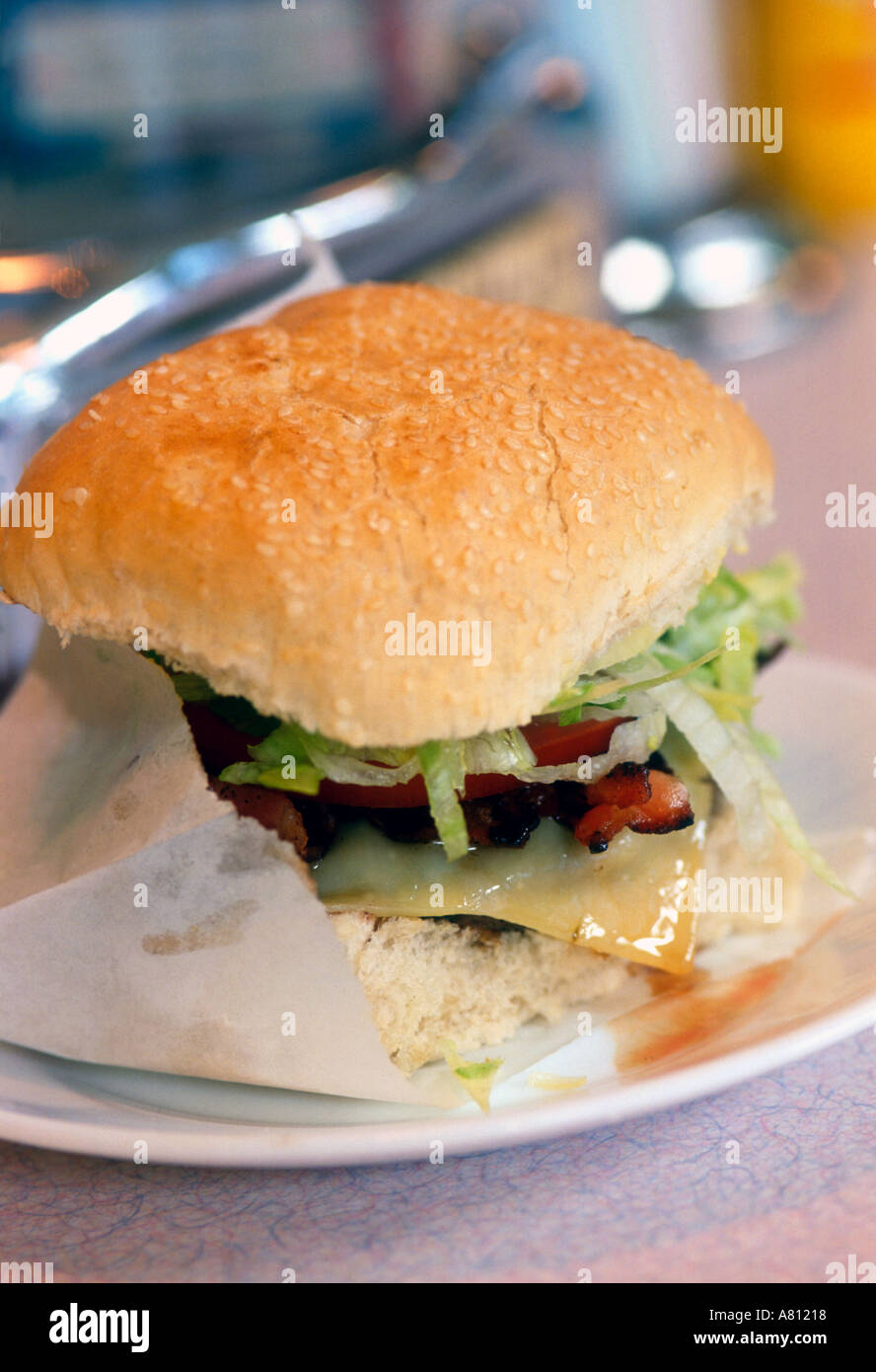 Hamburger in paper bag on counter of American style diner Stock Photo ...