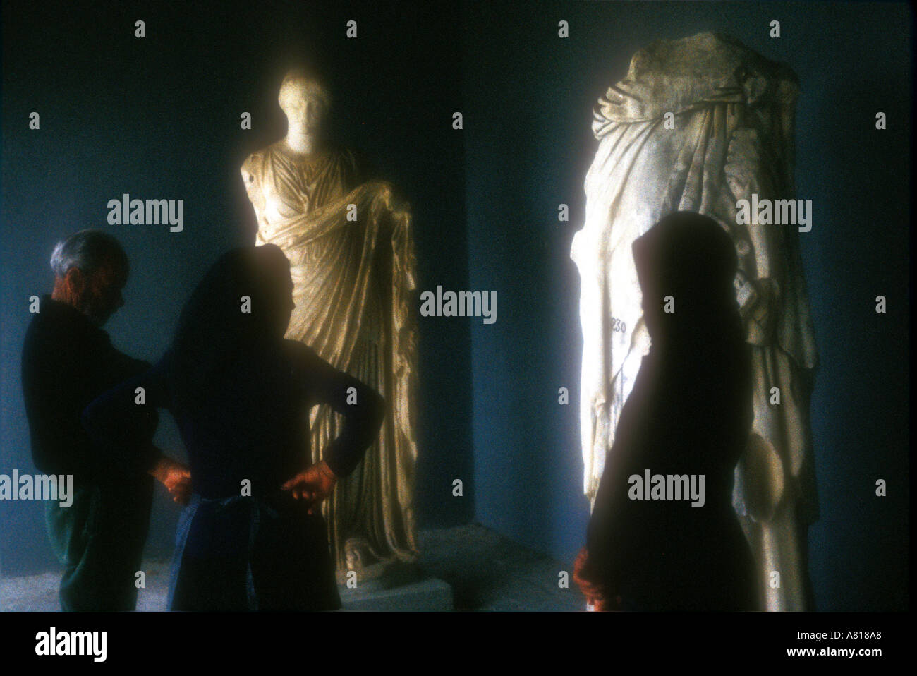 Local people looking at Greek statues in museum Crete Greece Stock ...