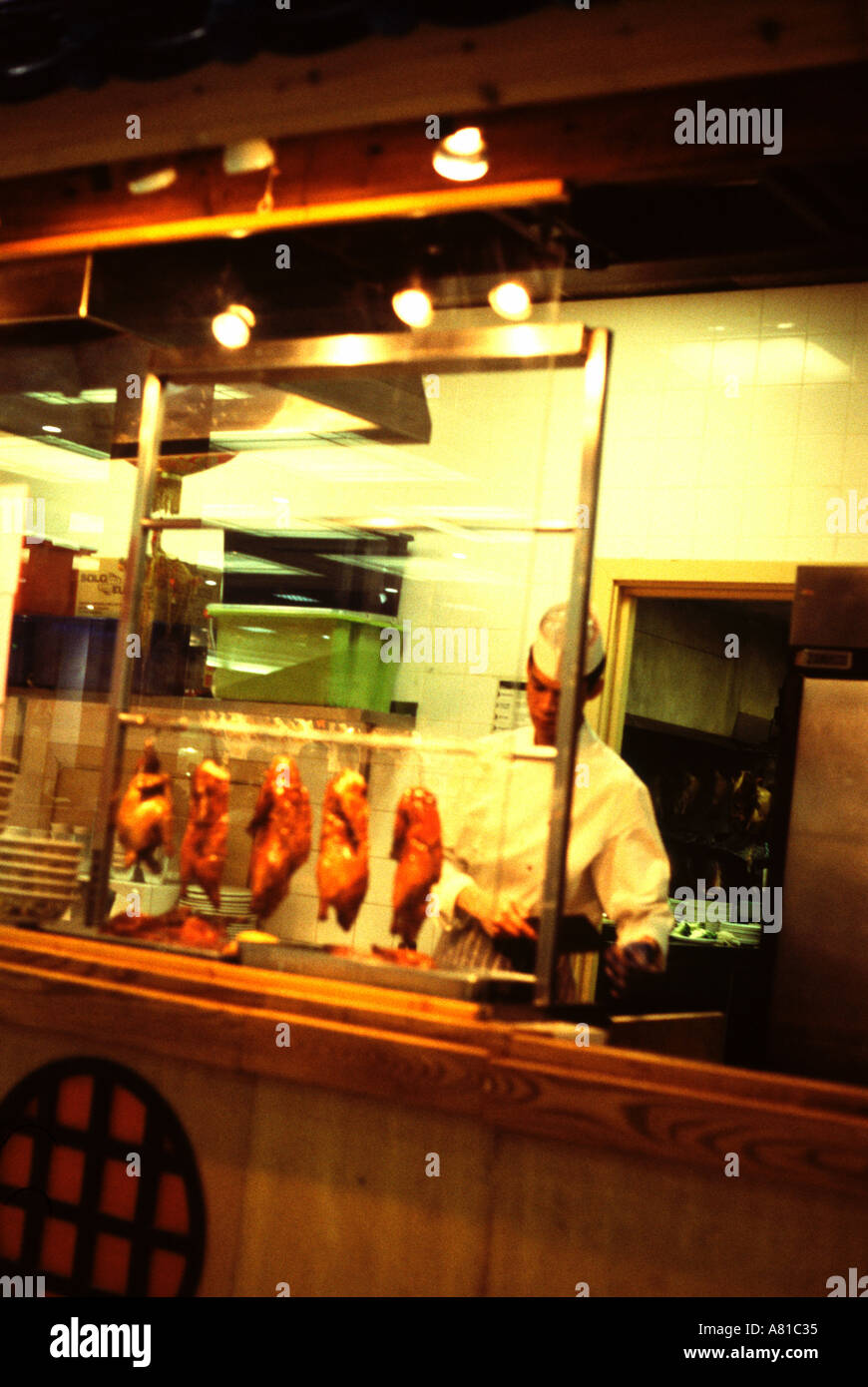 Chef behind counter at Chinese food stall in Oriental City London Stock ...