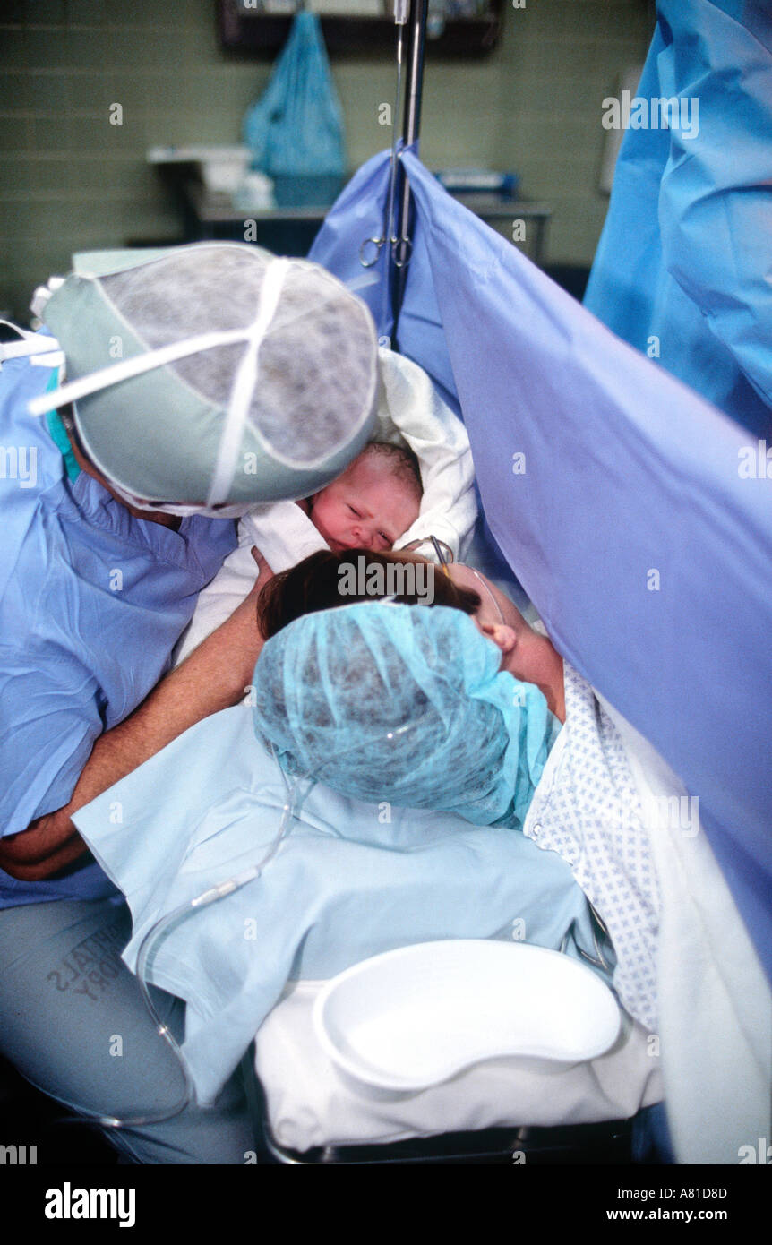mother and father get first look at their newborn baby in the operating ...