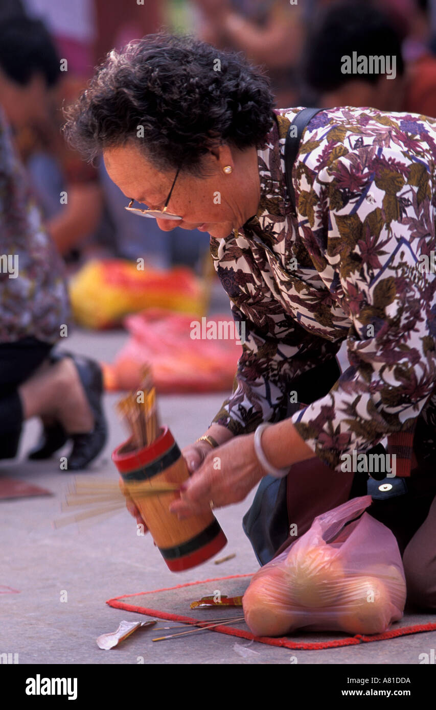 Chinese Lady Praying At Wong Tai Sin Temple Kowloon Hong Kong Stock ...