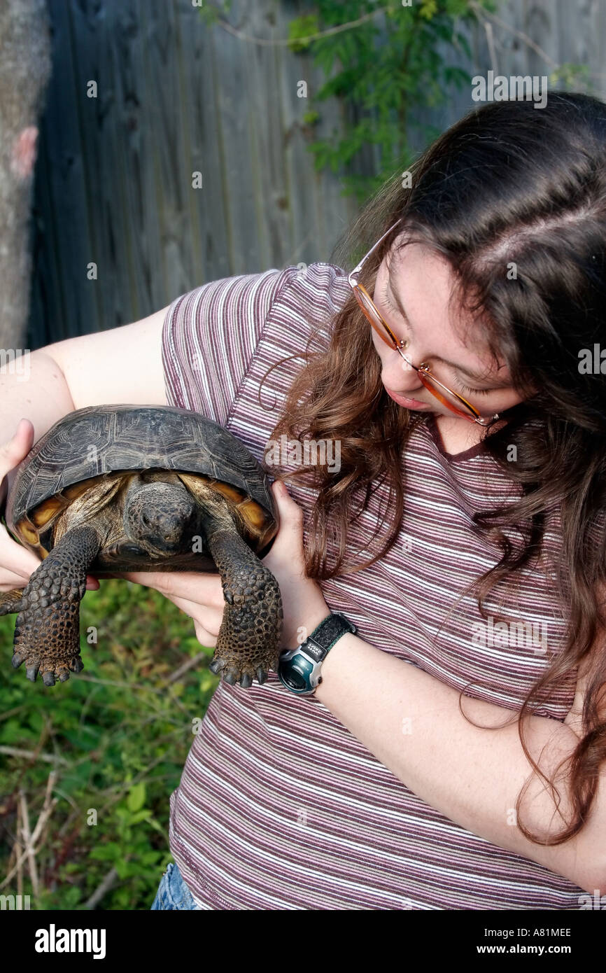 Young woman holding a Gopher tortoise gopherus polyphemus Stock Photo ...