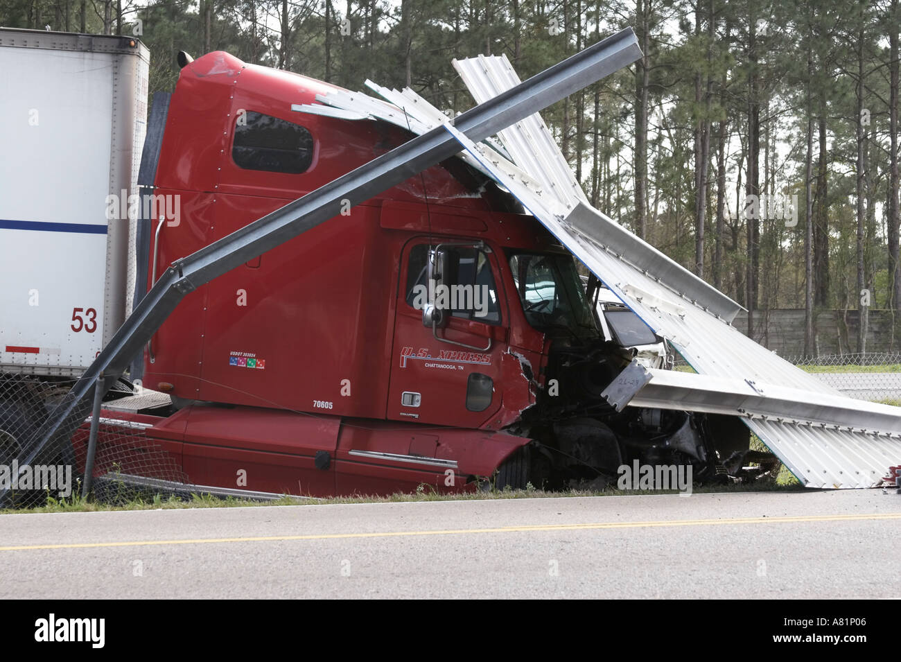 Tractor trailer rig that has crashed into a highway sign Stock Photo ...