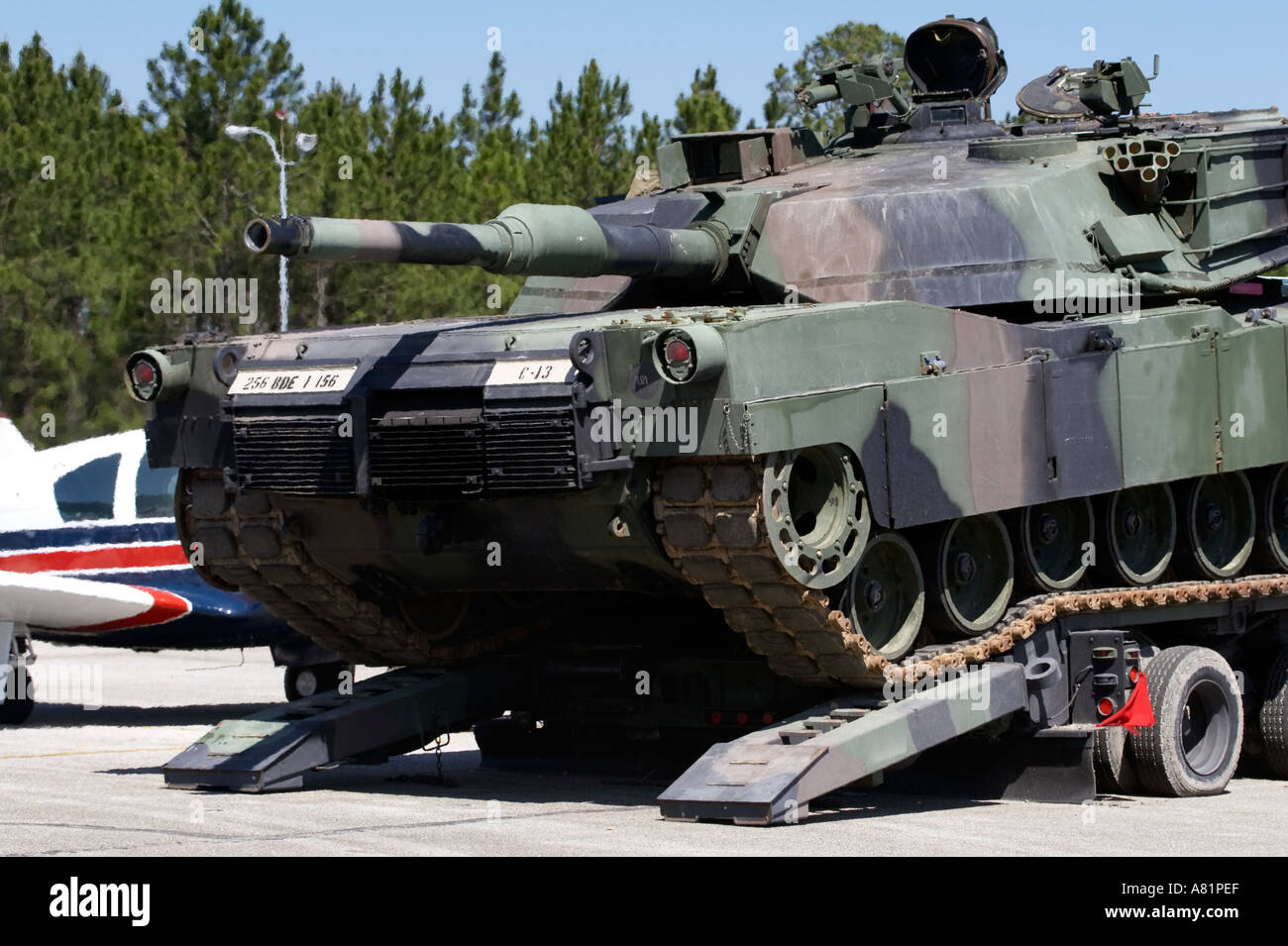 National Guard tank driving off a trailer at the Slidell Air Show ...