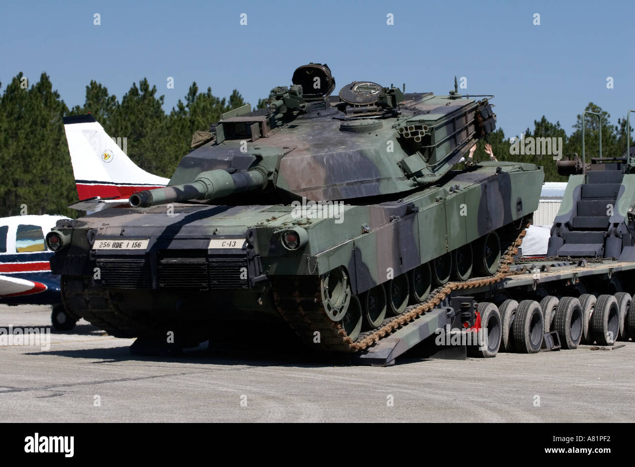 National Guard tank driving off a trailer at the Slidell Air Show ...