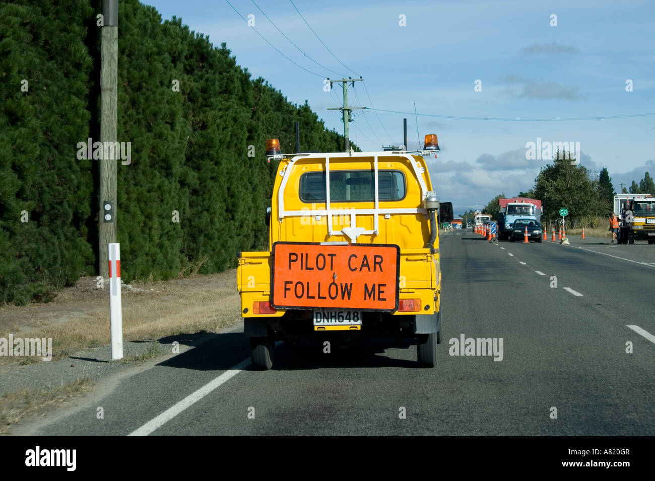 Pilot Car with Follow Me Sign New Zealand Stock Photo - Alamy
