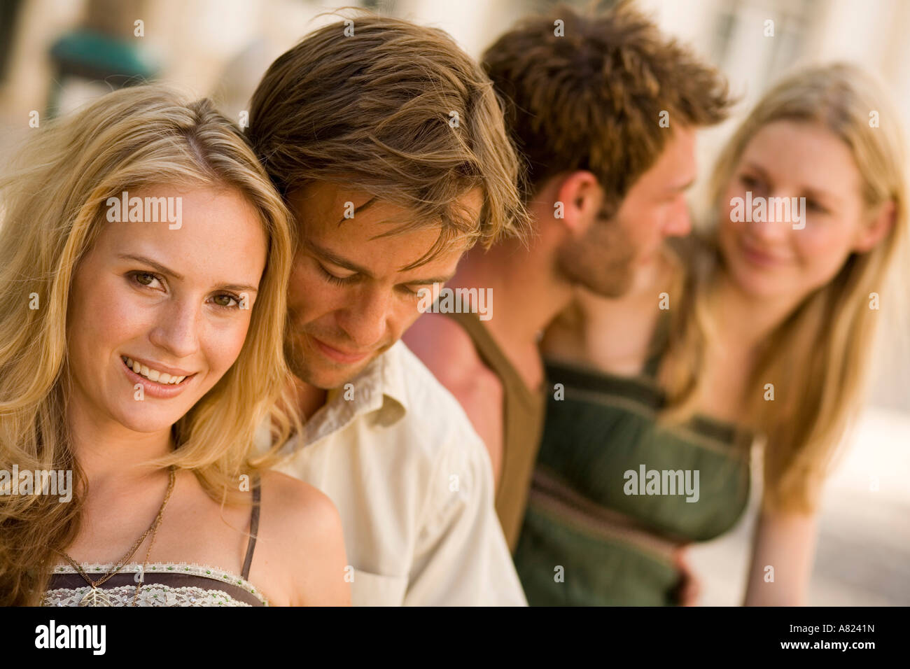 Two couples sitting outdoors Stock Photo - Alamy