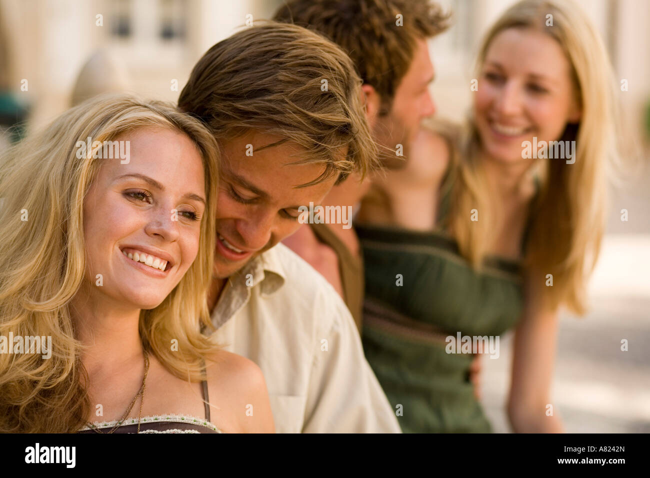 Two couples sitting outdoors Stock Photo - Alamy