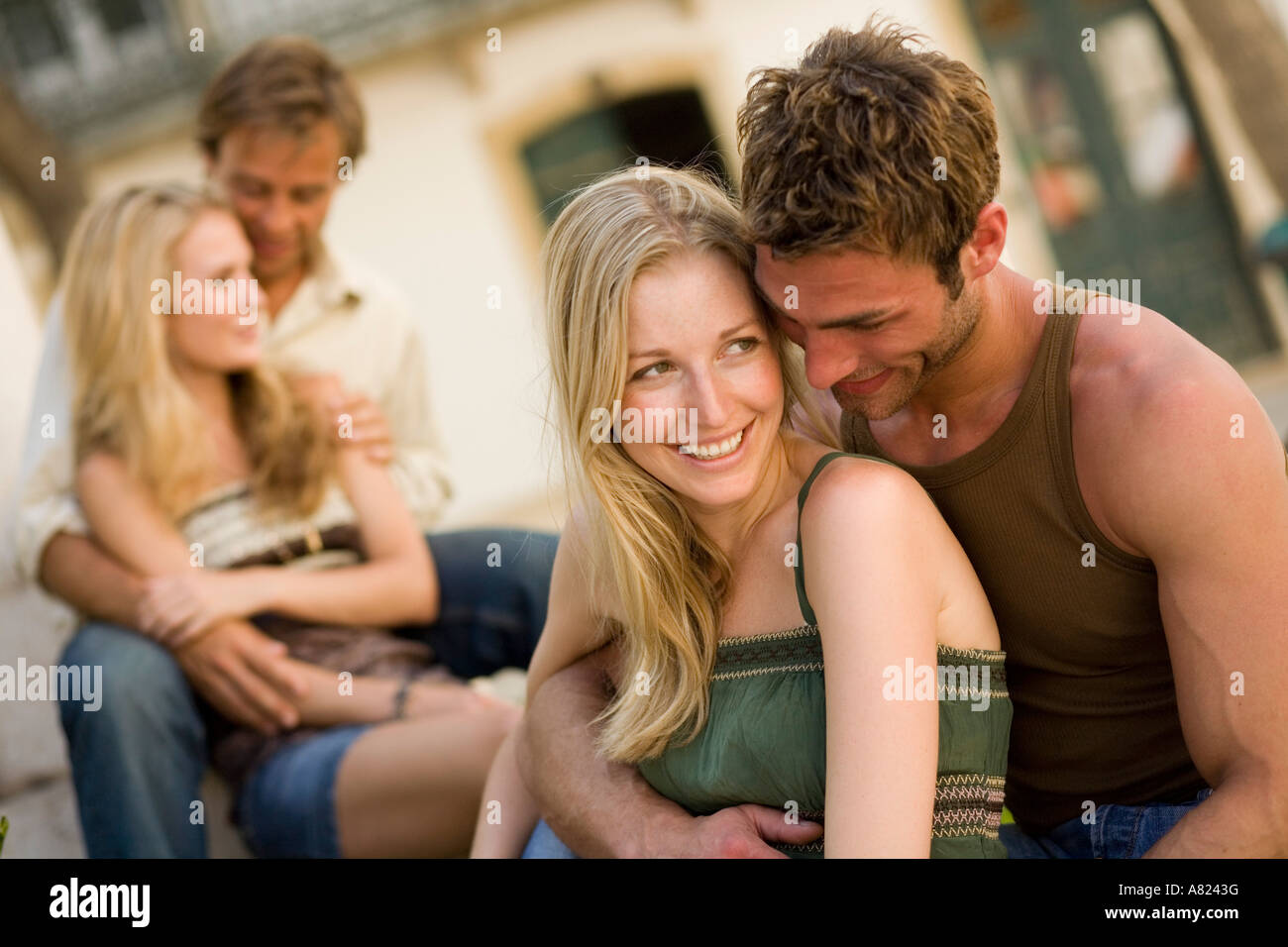 Two couples sitting outdoors Stock Photo - Alamy