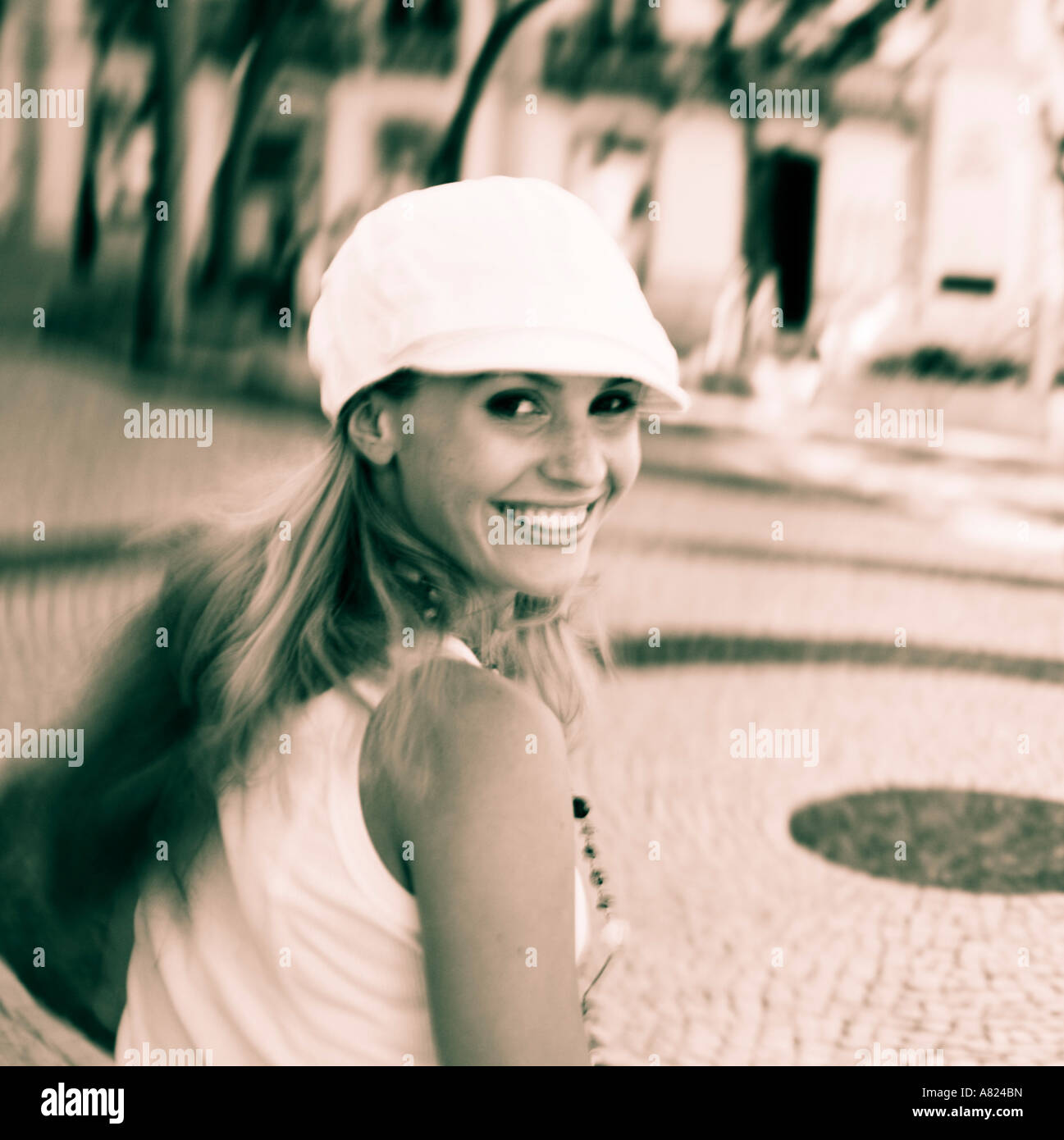 A young woman walking in town Stock Photo - Alamy