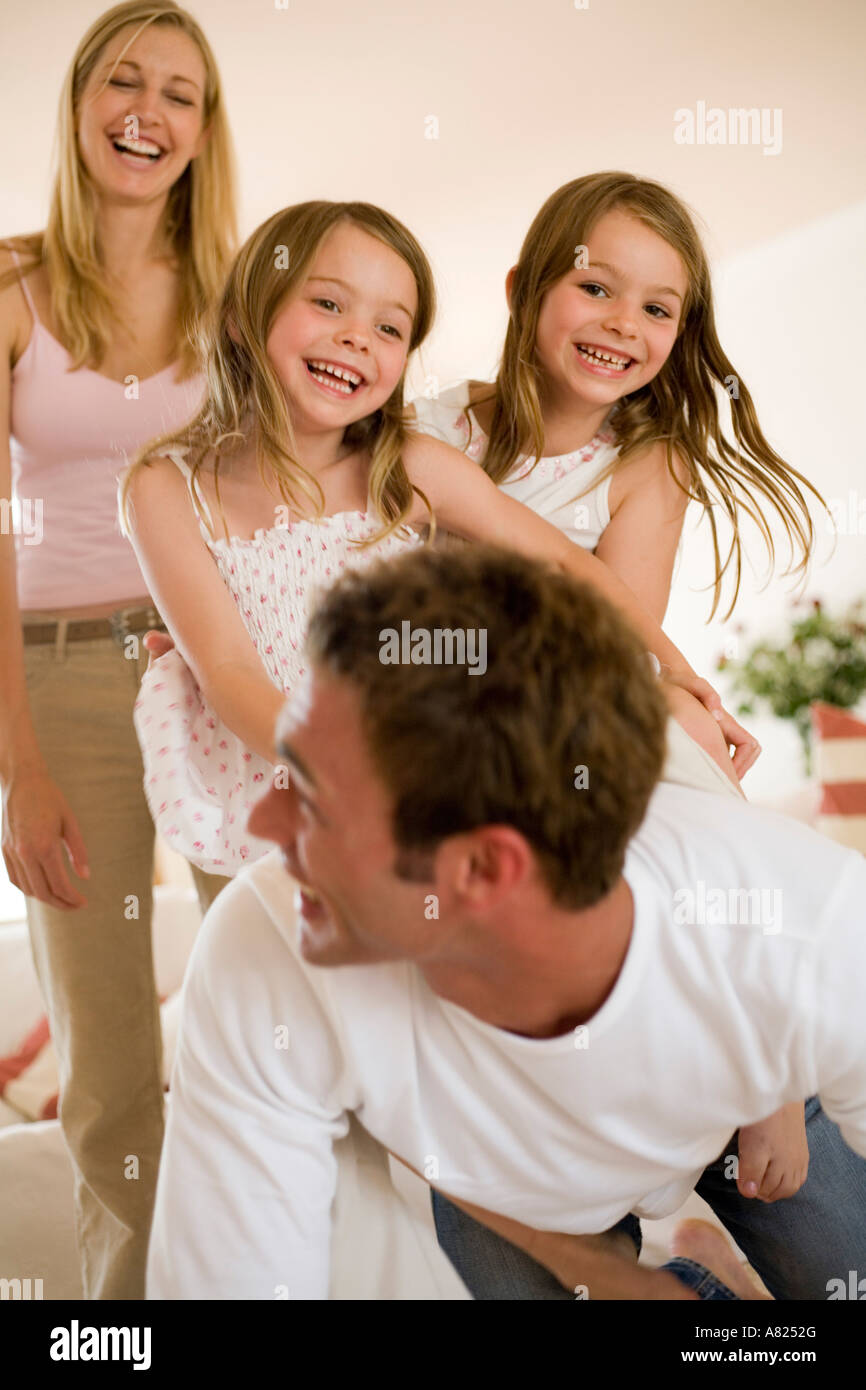 A family at home together Stock Photo - Alamy