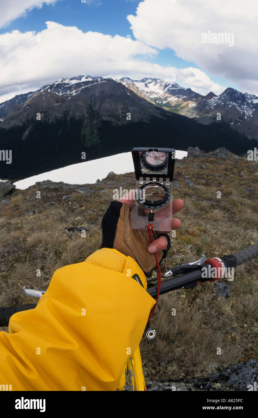 Mountain biker using compass Babine Mountains Provincial Park British ...