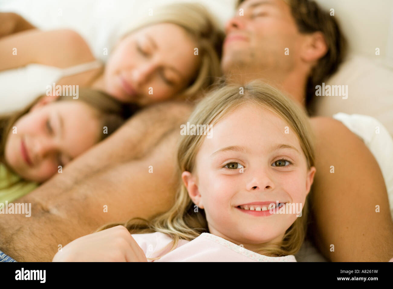 A family relaxing in bed at home Stock Photo - Alamy