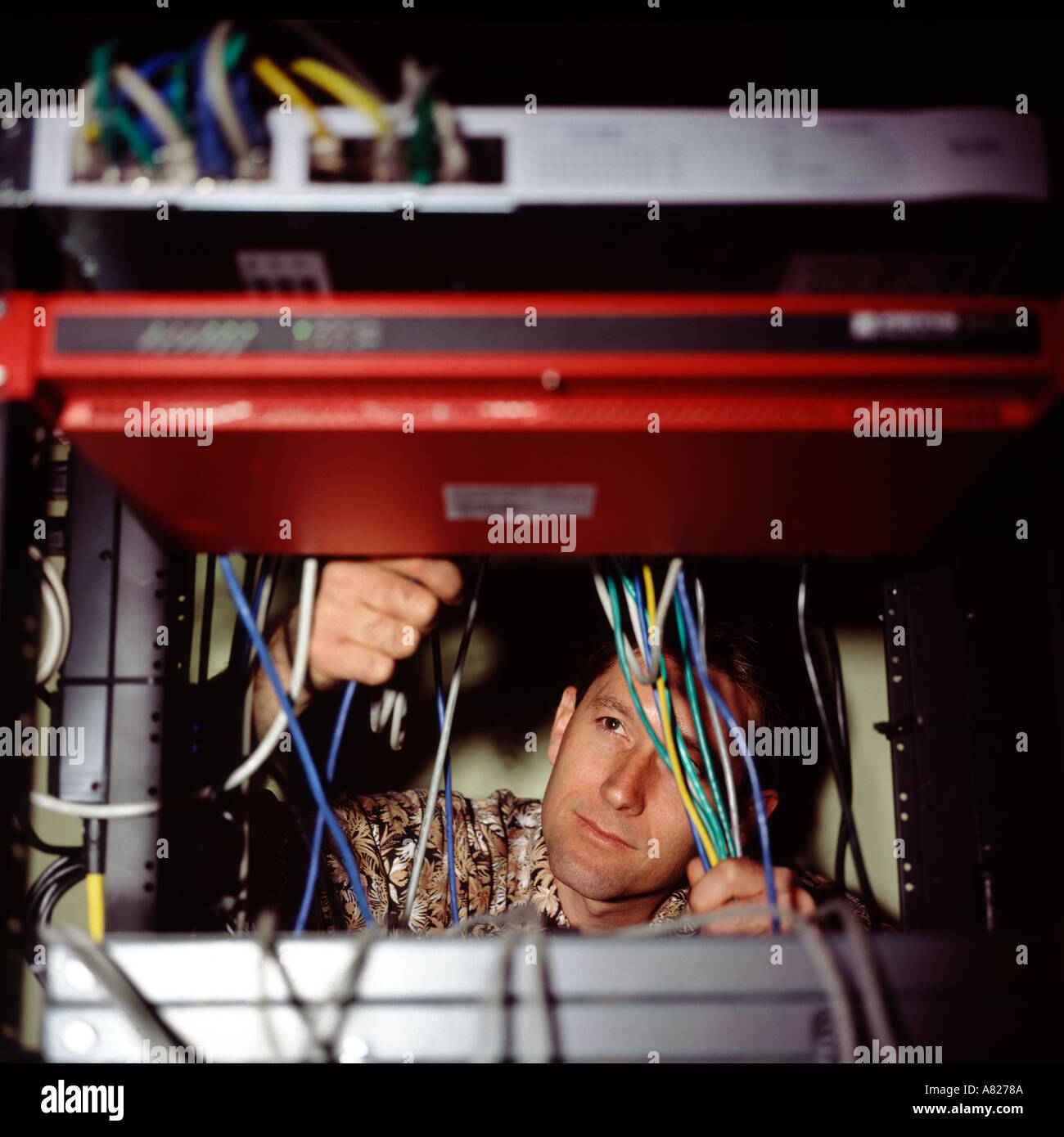man adjusting network connections Stock Photo - Alamy