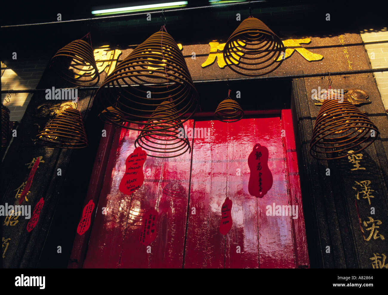 Chinese red temple door with spiral incenses yaumatei temple complex ...
